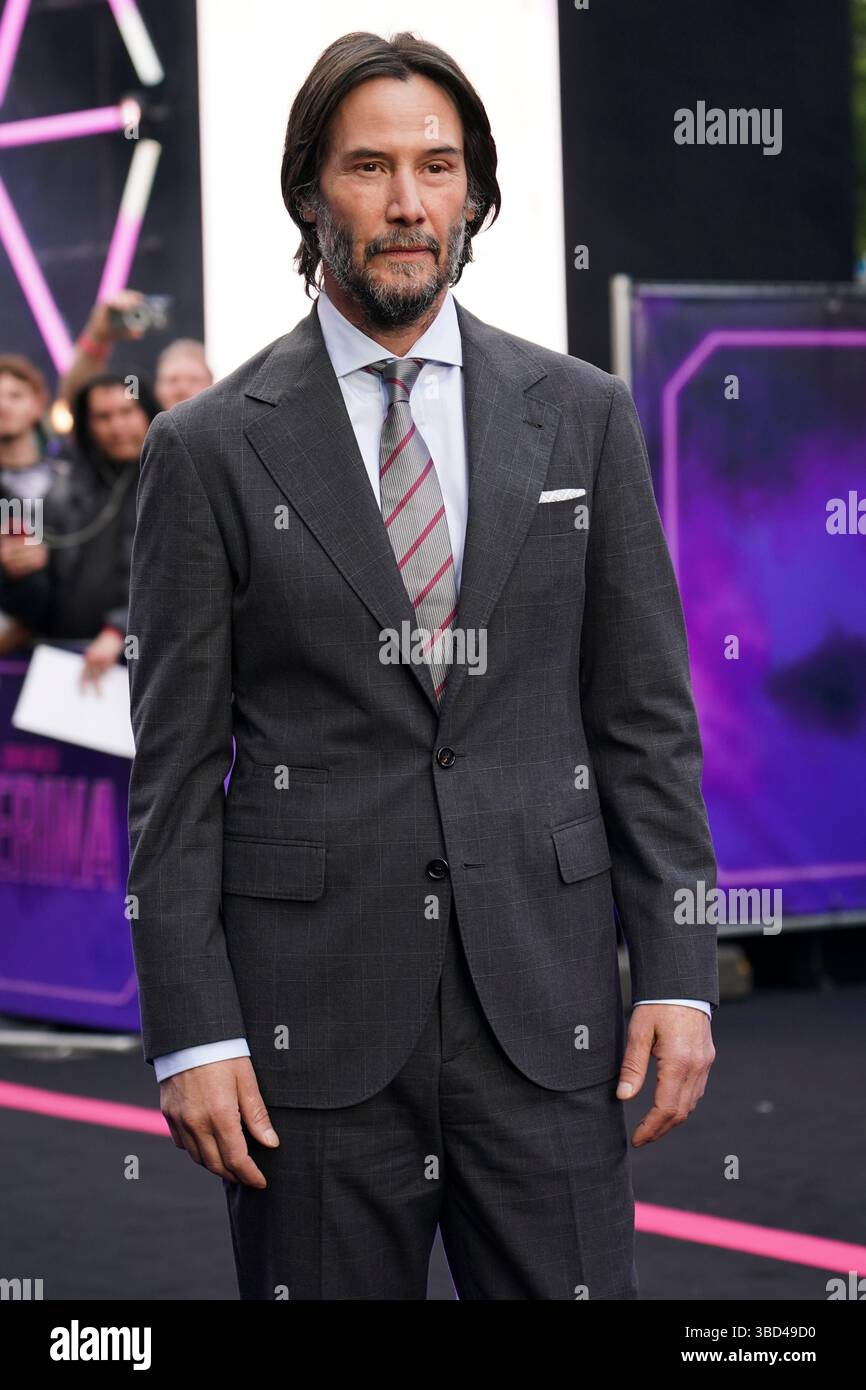 Keanu Reeves poses for photographers upon arrival at the World premiere ...