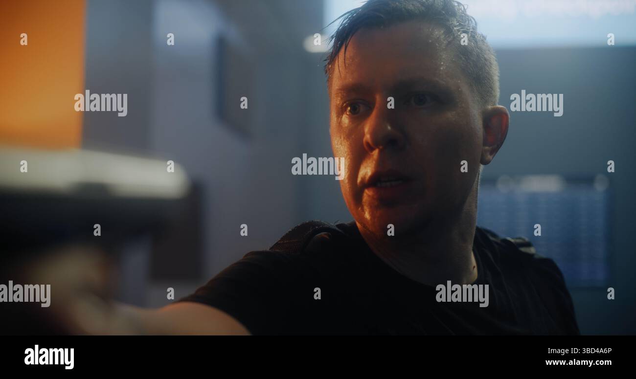 Epic Action Movie Scene: Tired Male Criminal in Black Tactical Clothing ...