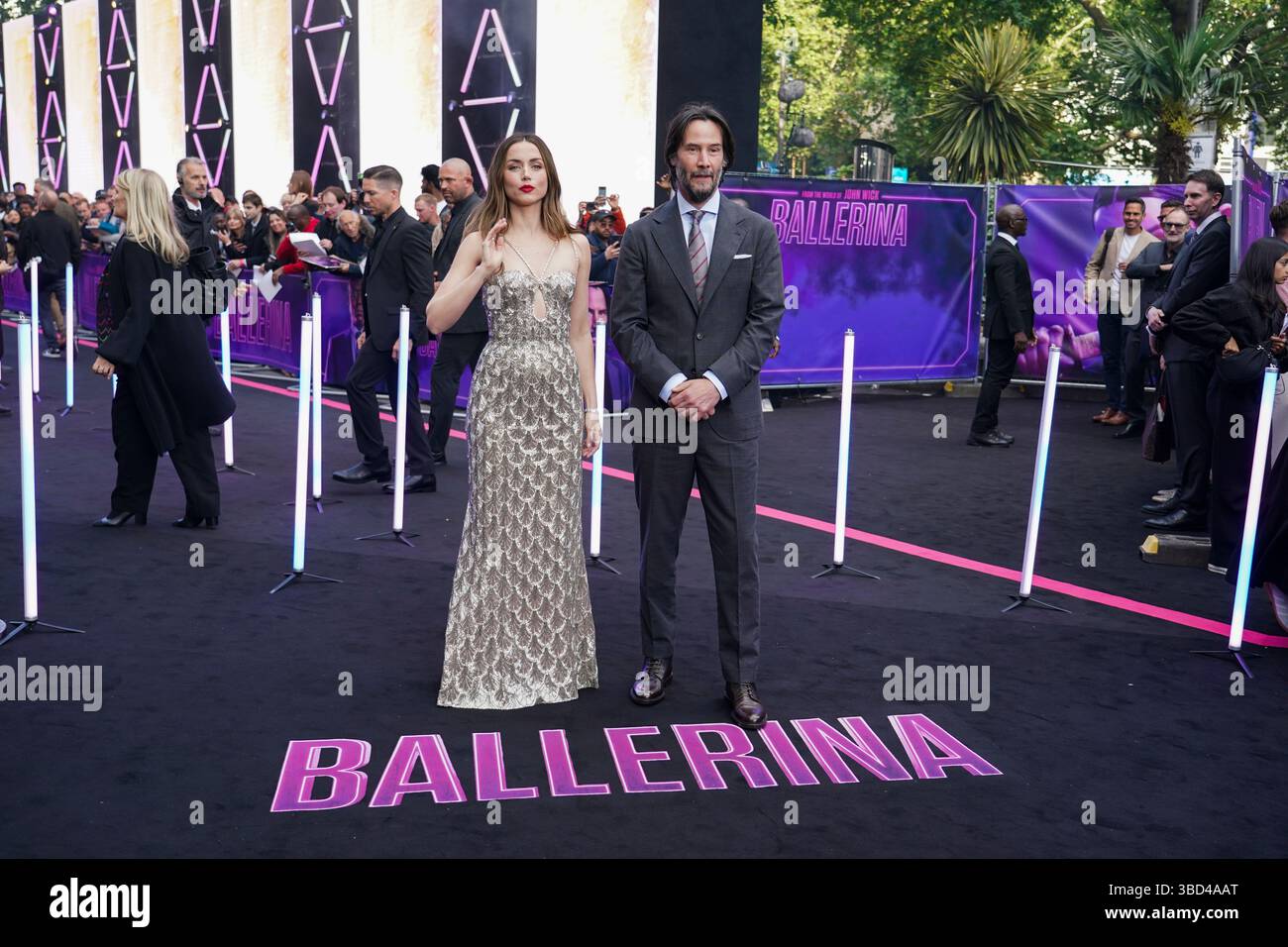 Ana de Armas, left, and Keanu Reeves pose for photographers upon ...