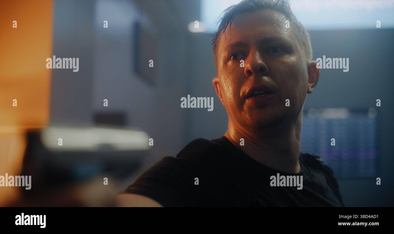 Epic Action Movie Scene: Tired Male Criminal in Black Tactical Clothing ...