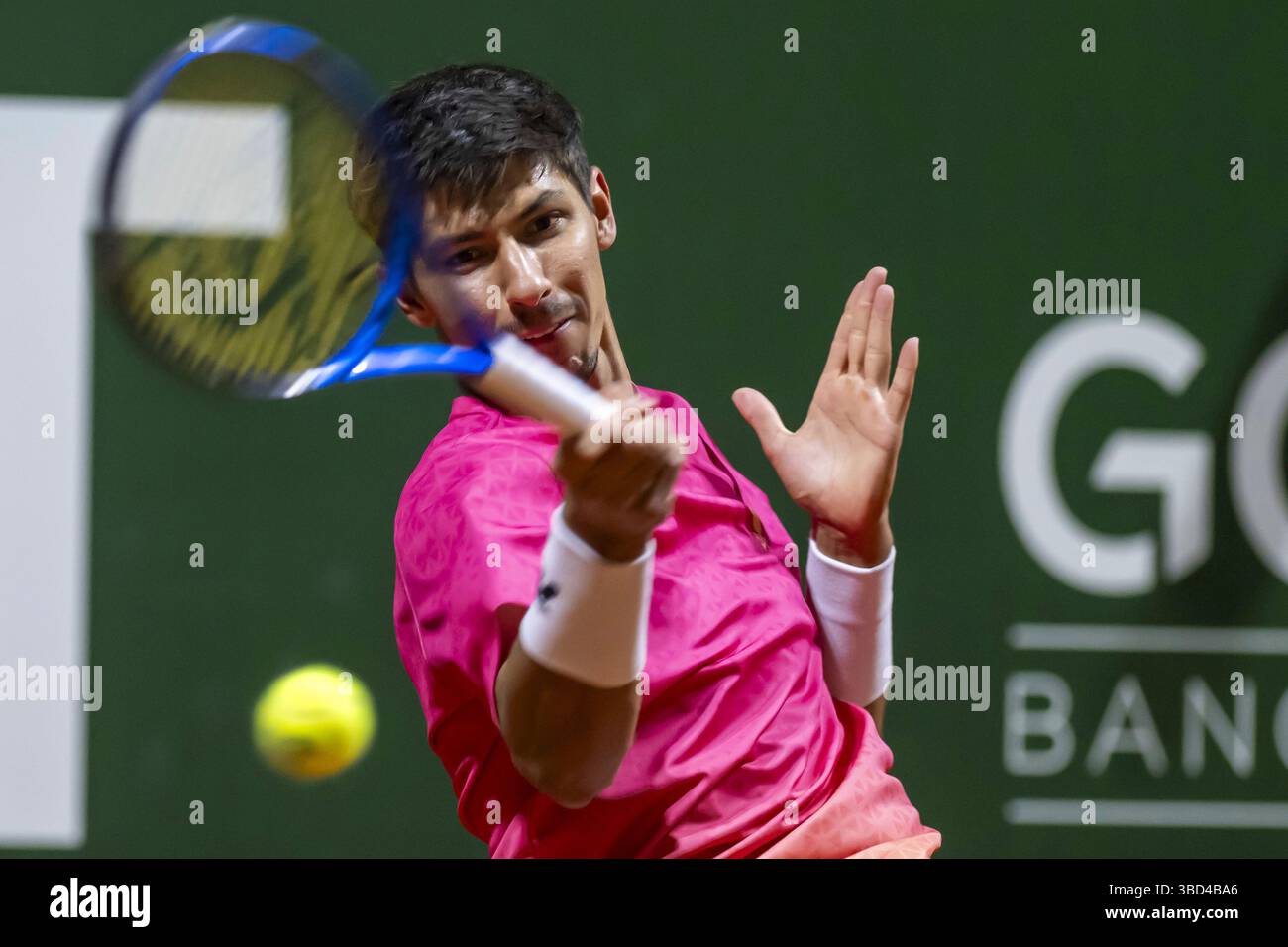 Alexei Popyrin, of Australia, returns a ball to Cameron Norrie, of ...