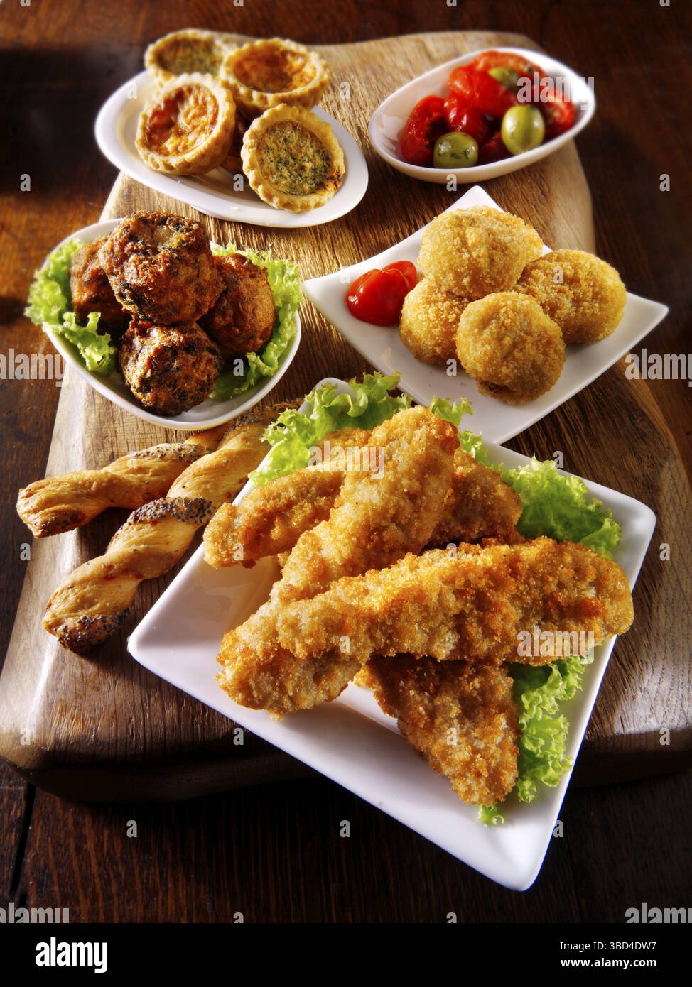 Party buffet food with southern fried chicken, bhajis, mini quiche and ...