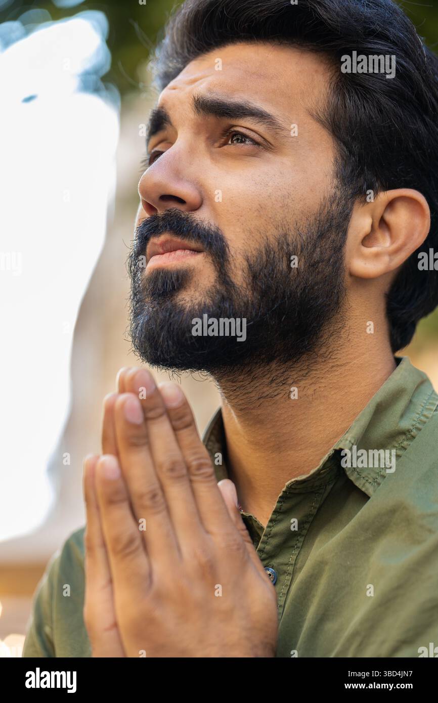 Bearded religion indian man praying with closed eyes to God asking for ...