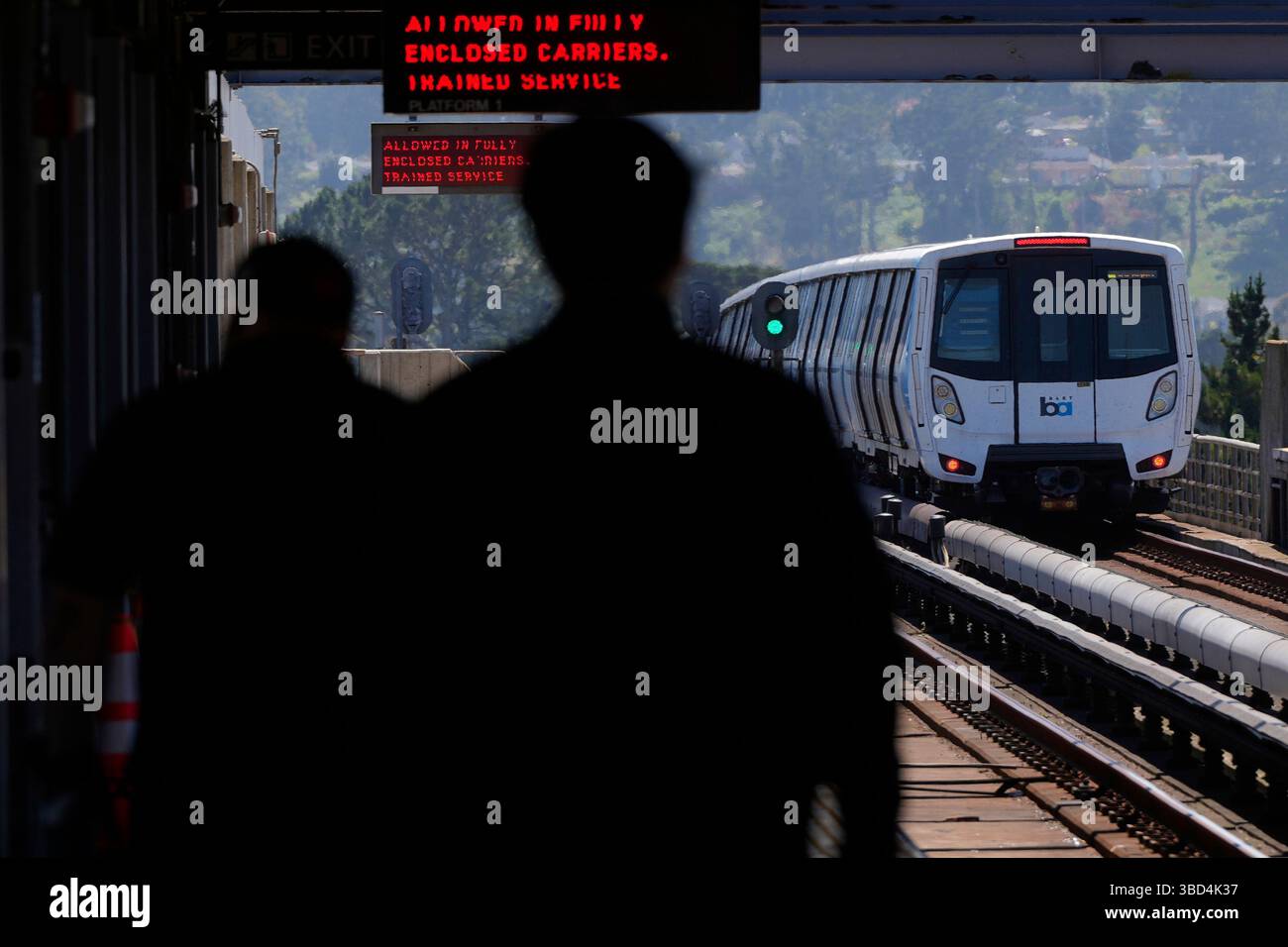 Passenger walk on the platform near at Bay Area Rapid Transit train at ...