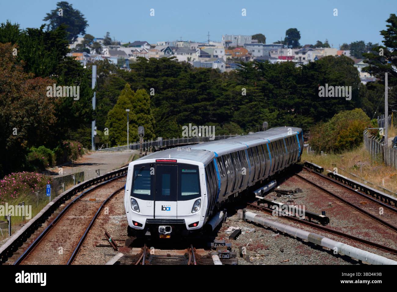 A Bay Area Rapid Transit train approaches a BART station in Daly City ...