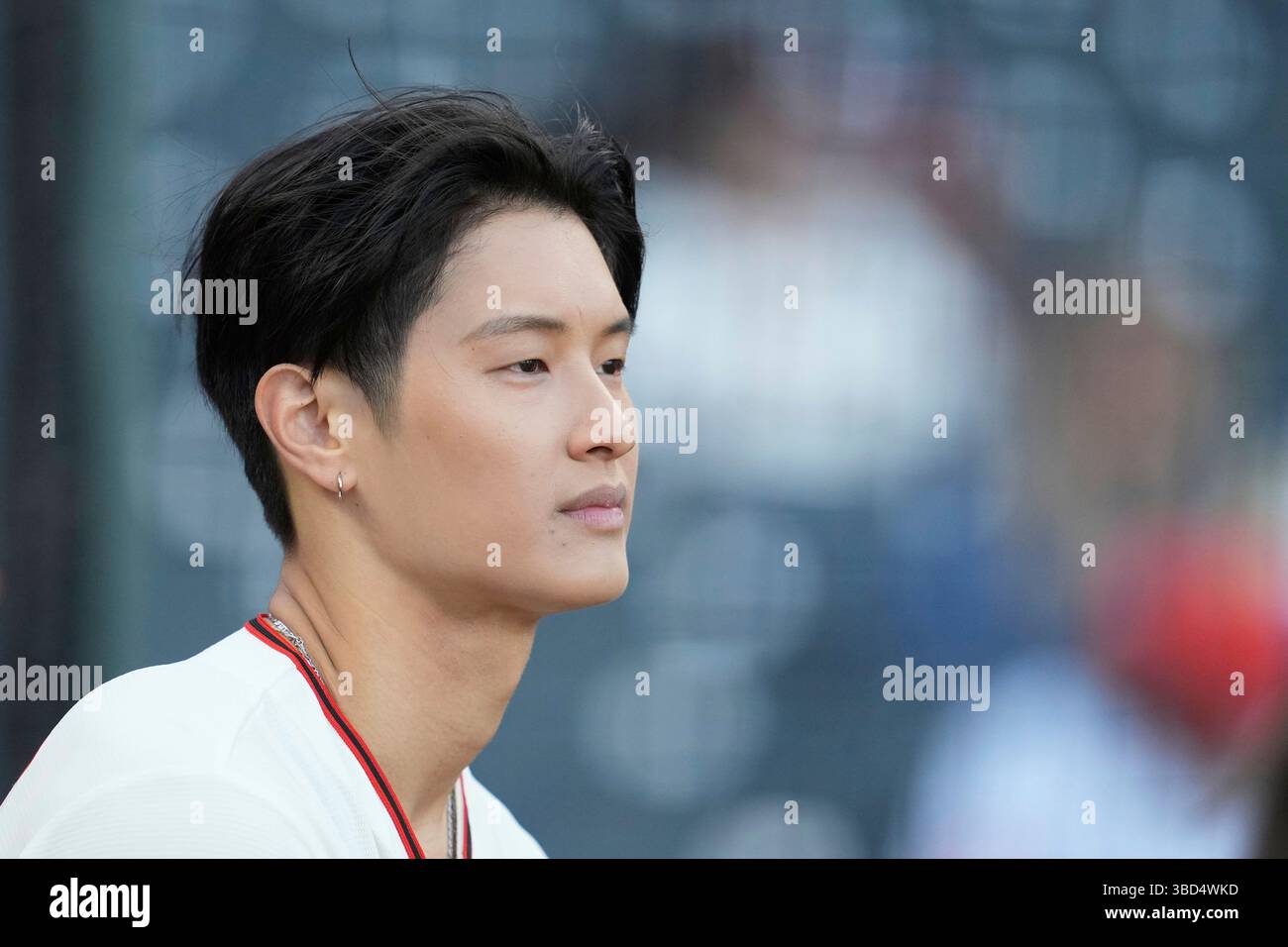 Musician sunkis is shown before throwing a ceremonial first pitch ...