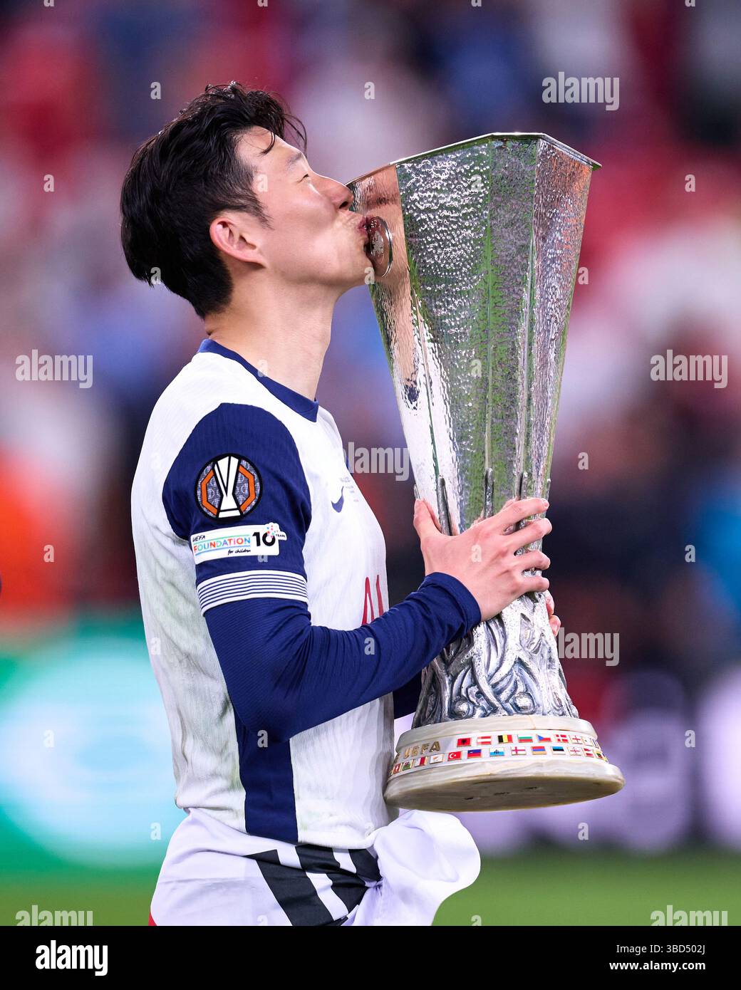 Heung-Min Son of Tottenham Hotspur kiss the trophy during the UEFA ...