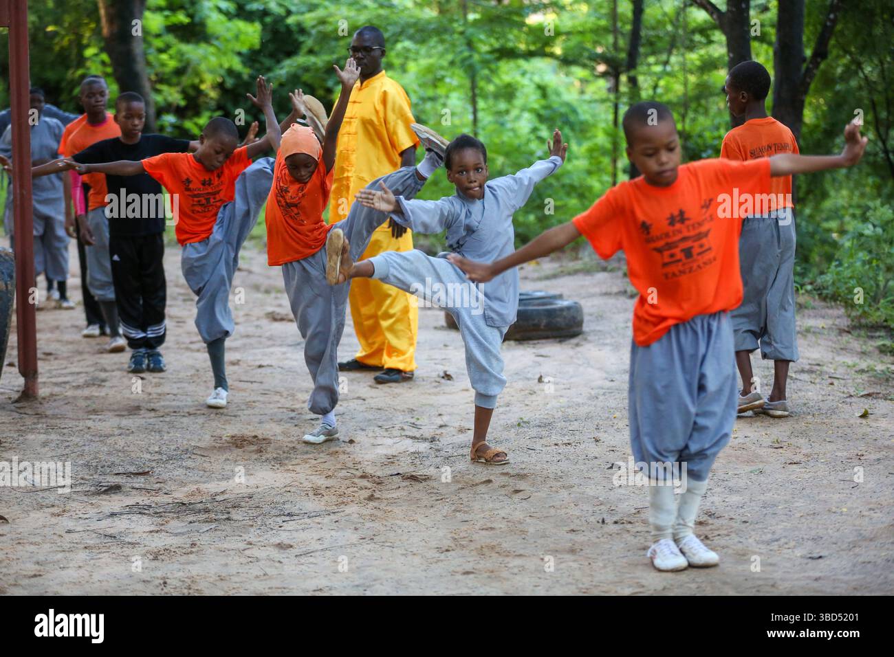 Dar Es Salaam, Tanzania. 18th May, 2025. Saidi Mfaume (in yellow), a ...
