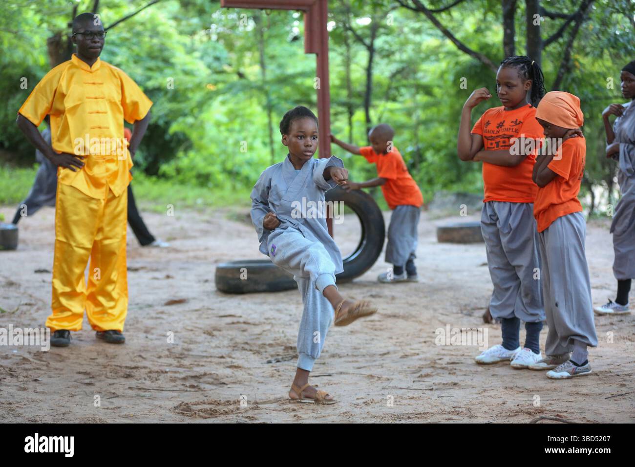 Dar Es Salaam, Tanzania. 18th May, 2025. Saidi Mfaume (in yellow), a ...