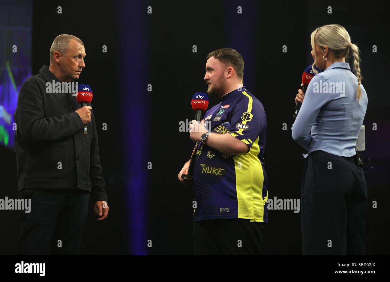 Winner Luke Littler speaks with Sky Sports' Wayne Mardle (left) and ...