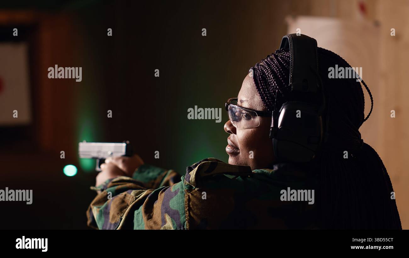 Portrait of happy soldier holding assault rifle, developing ...