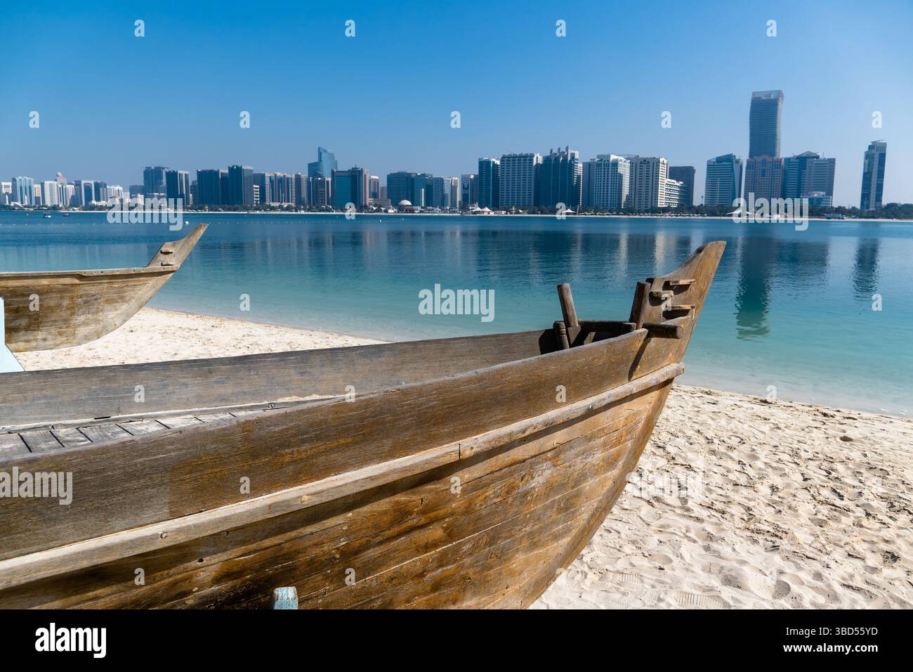 Traditional Wooden Dhow on Sandy Beach with Abu Dhabi Skyline, United ...