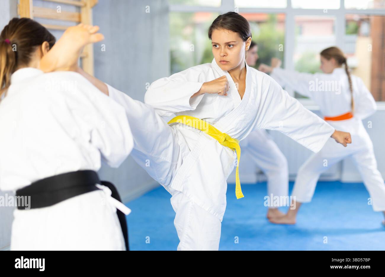 Girl opponent punches enemy with feet and hands, using all strength ...