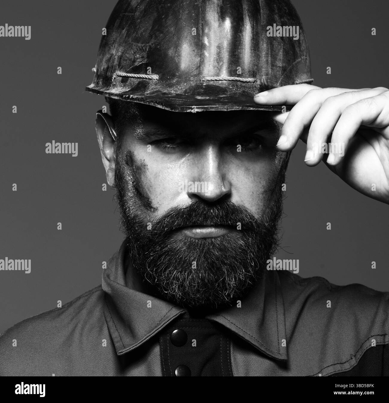 Professional builder in uniform hard Black and White Stock Photos ...