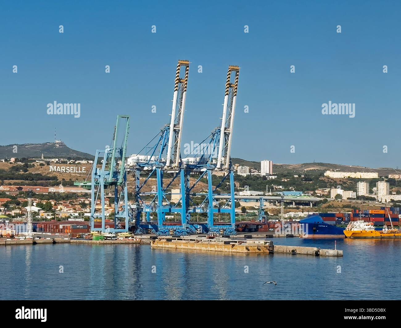 Marseille, France - July 10, 2024: 3 giant cranes in container terminal ...