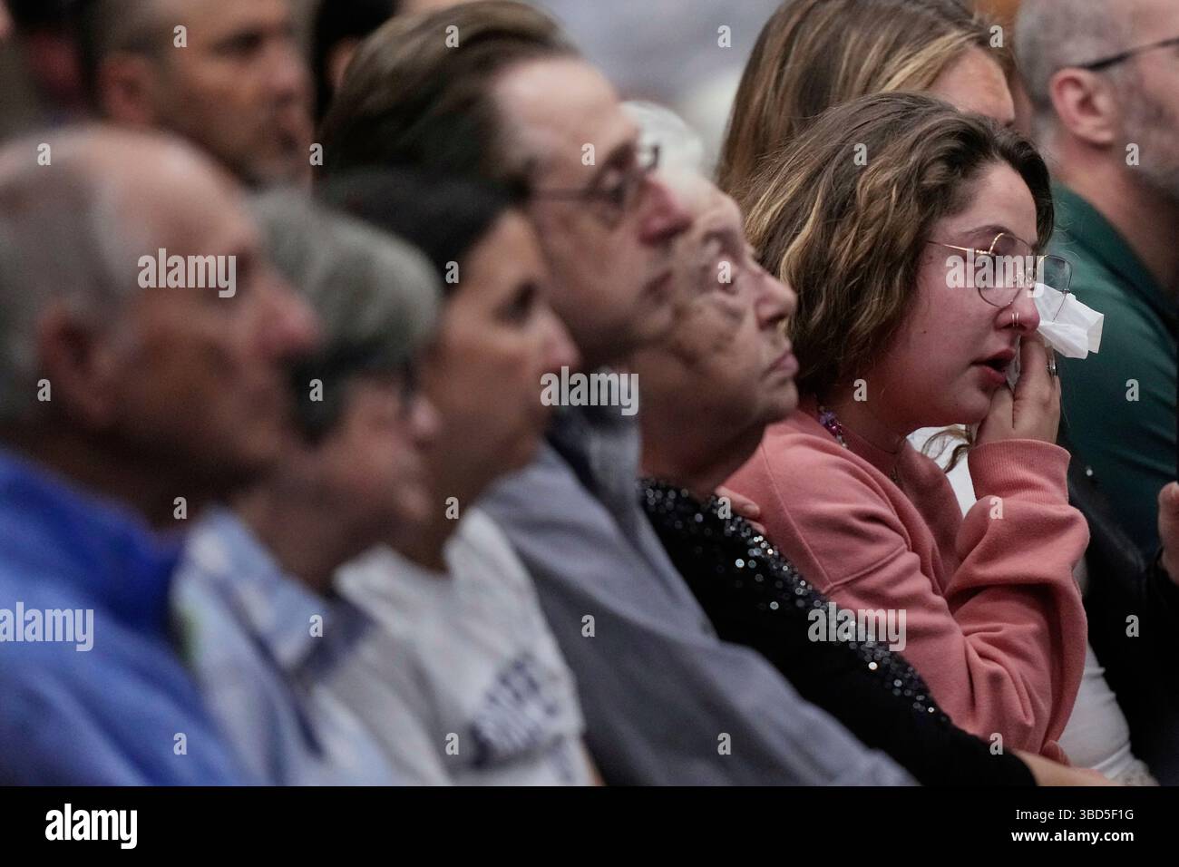 Emily Birger wipes away tears during a vigil for Sarah Milgrim and ...