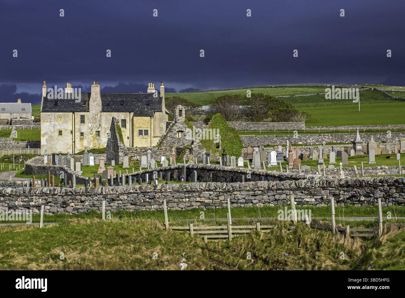 Black storm clouds rolling in over ruined church and the Balnakeil ...