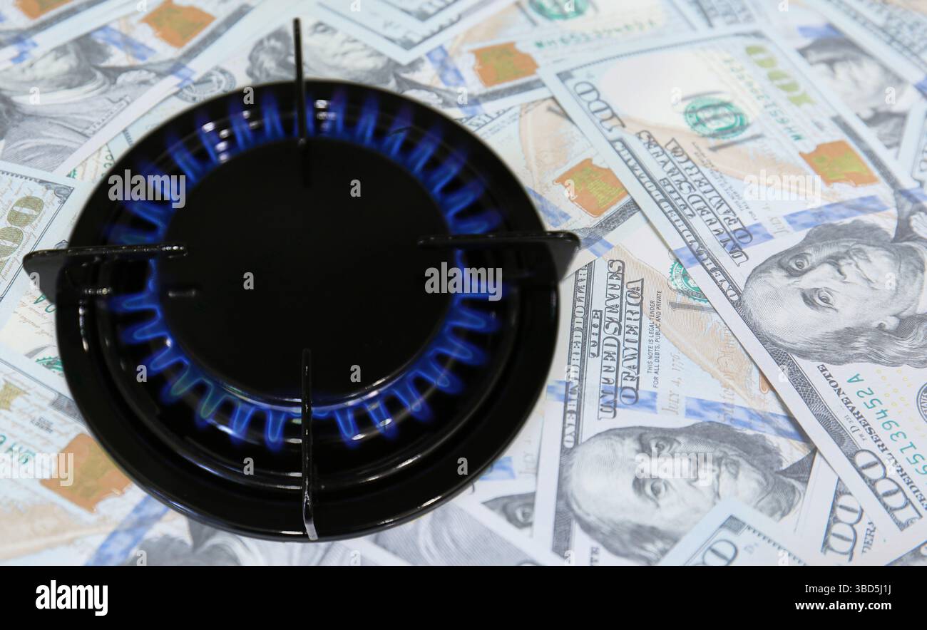 Gas burner with blue flame and dollar bills, double exposure. Gas ...