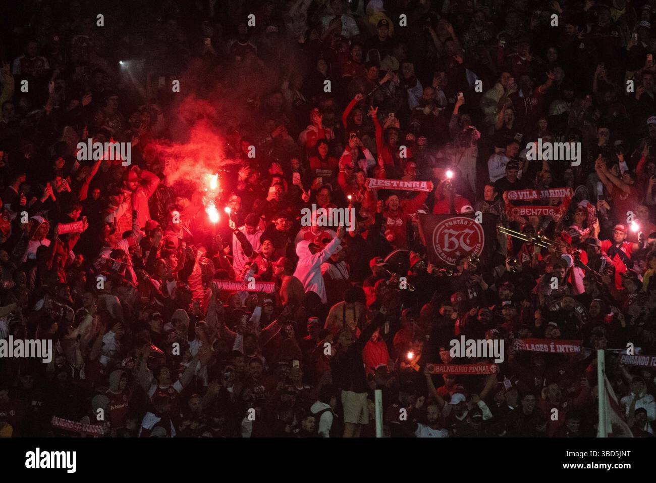 Florianopolis, Brazil. 22nd May, 2025. Internacional fans light flares ...