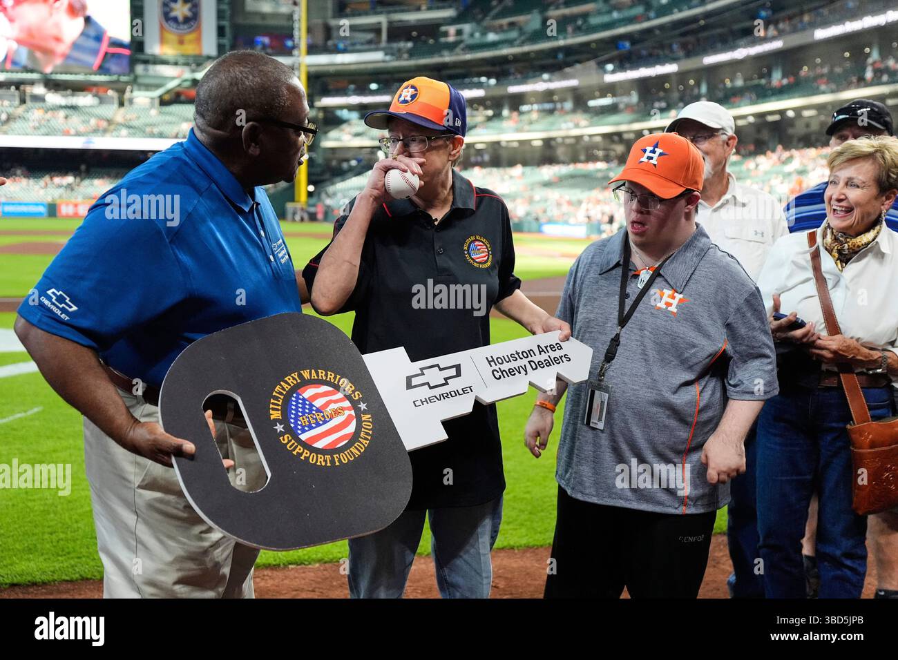 U.S. Army Staff Sergeant Michelle Hague, center, is presented with a ...