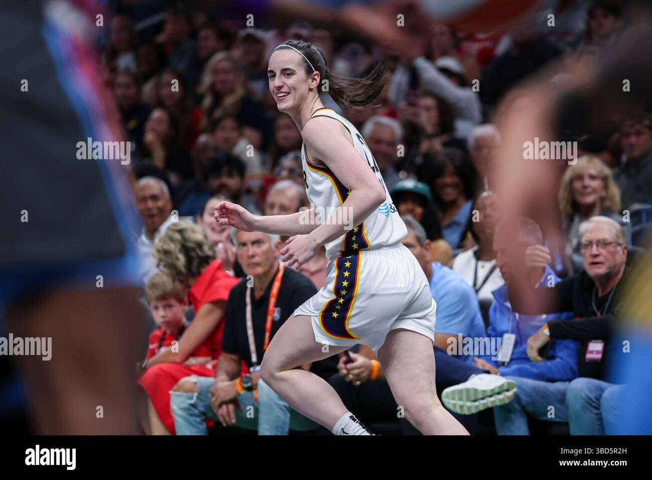 Indiana Fever guard Caitlin Clark reacts after making a three-pointer ...