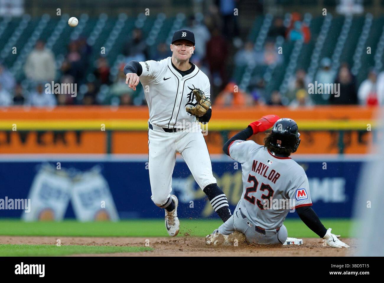 Detroit Tigers shortstop Trey Sweeney turns the ball after getting a ...