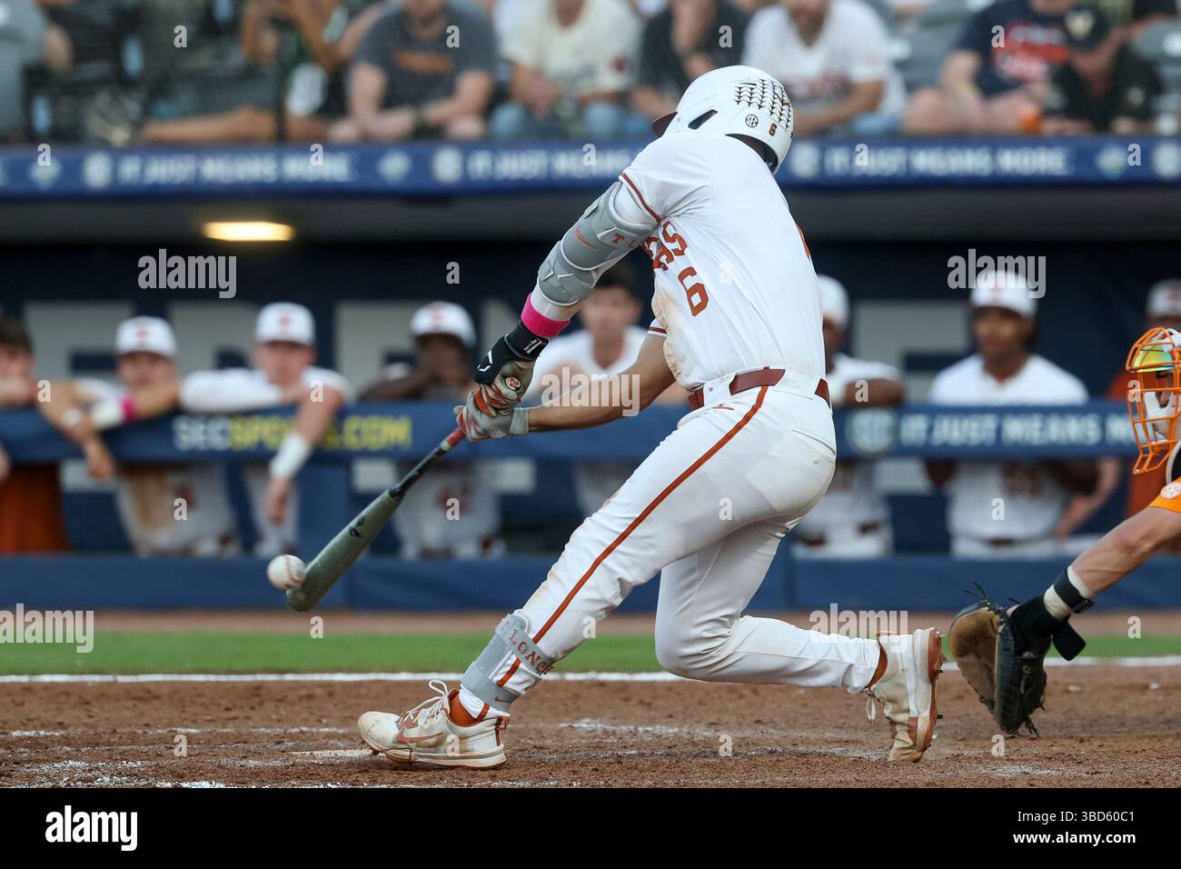 HOOVER, AL - MAY 22: Texas catcher Rylan Galvan (6) hits into a double ...