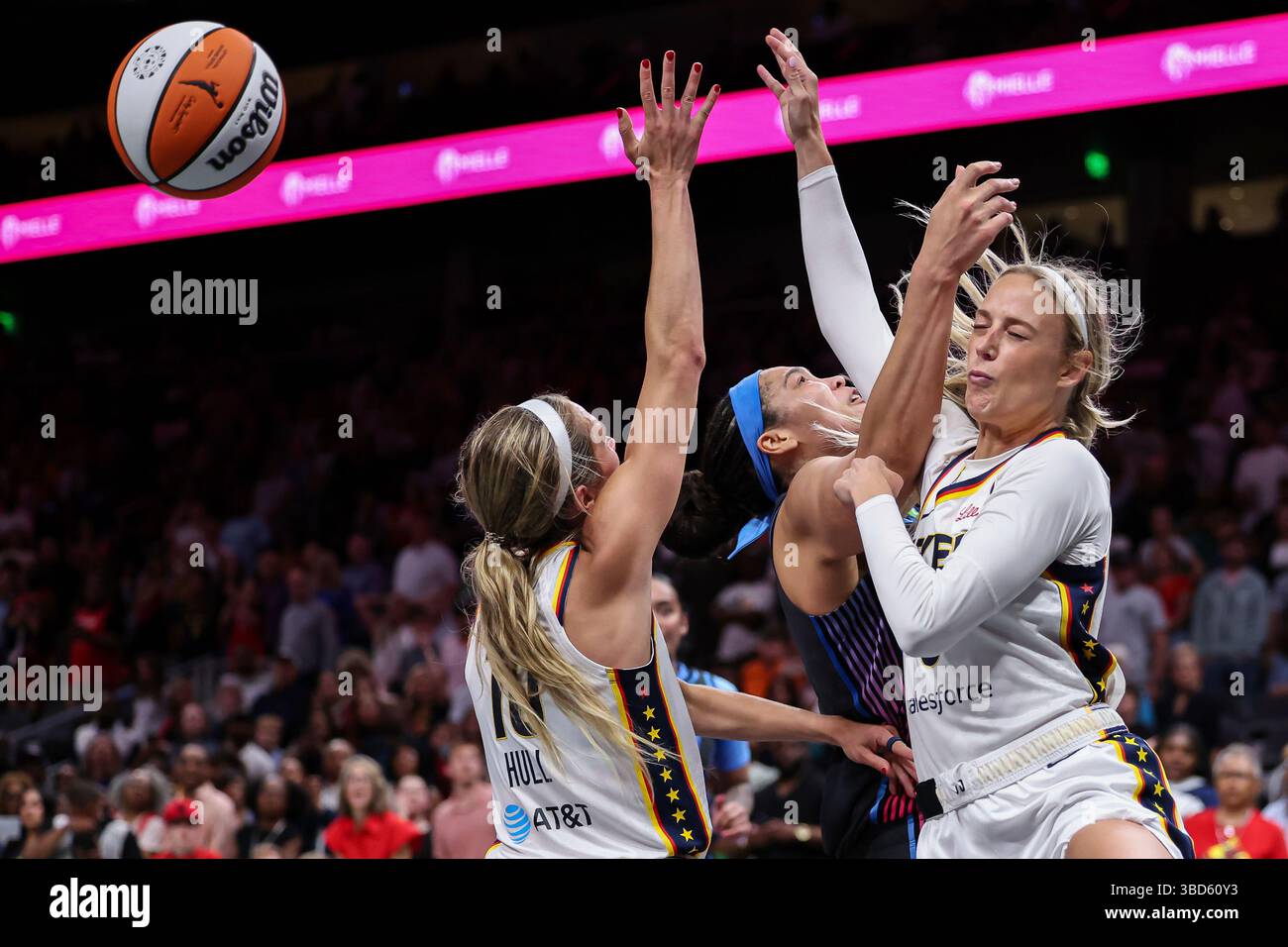Indiana Fever guard Sophie Cunningham, right, breaks up a pass attempt ...