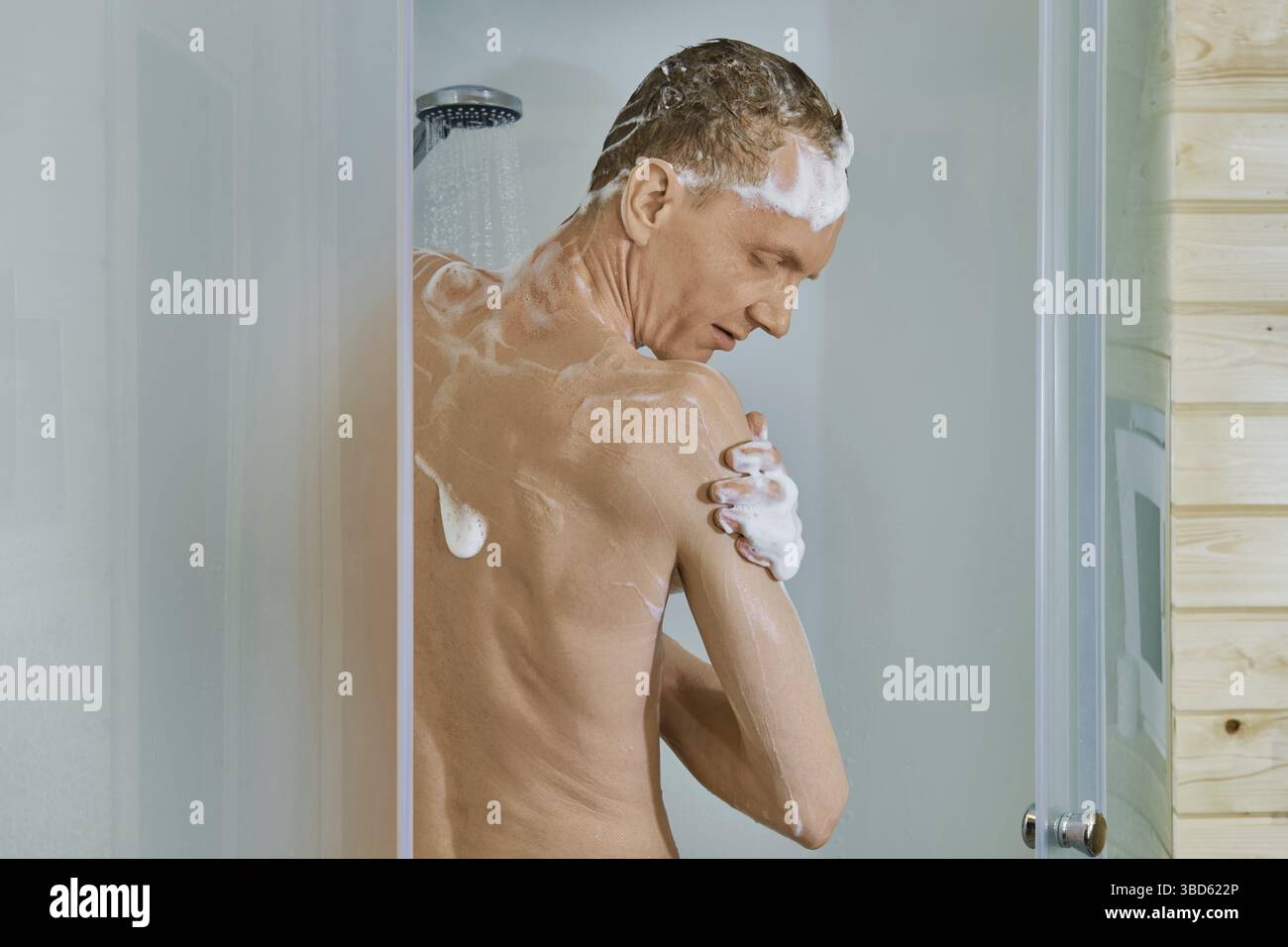 Man takes shower in hi-res stock photography and images - Alamy