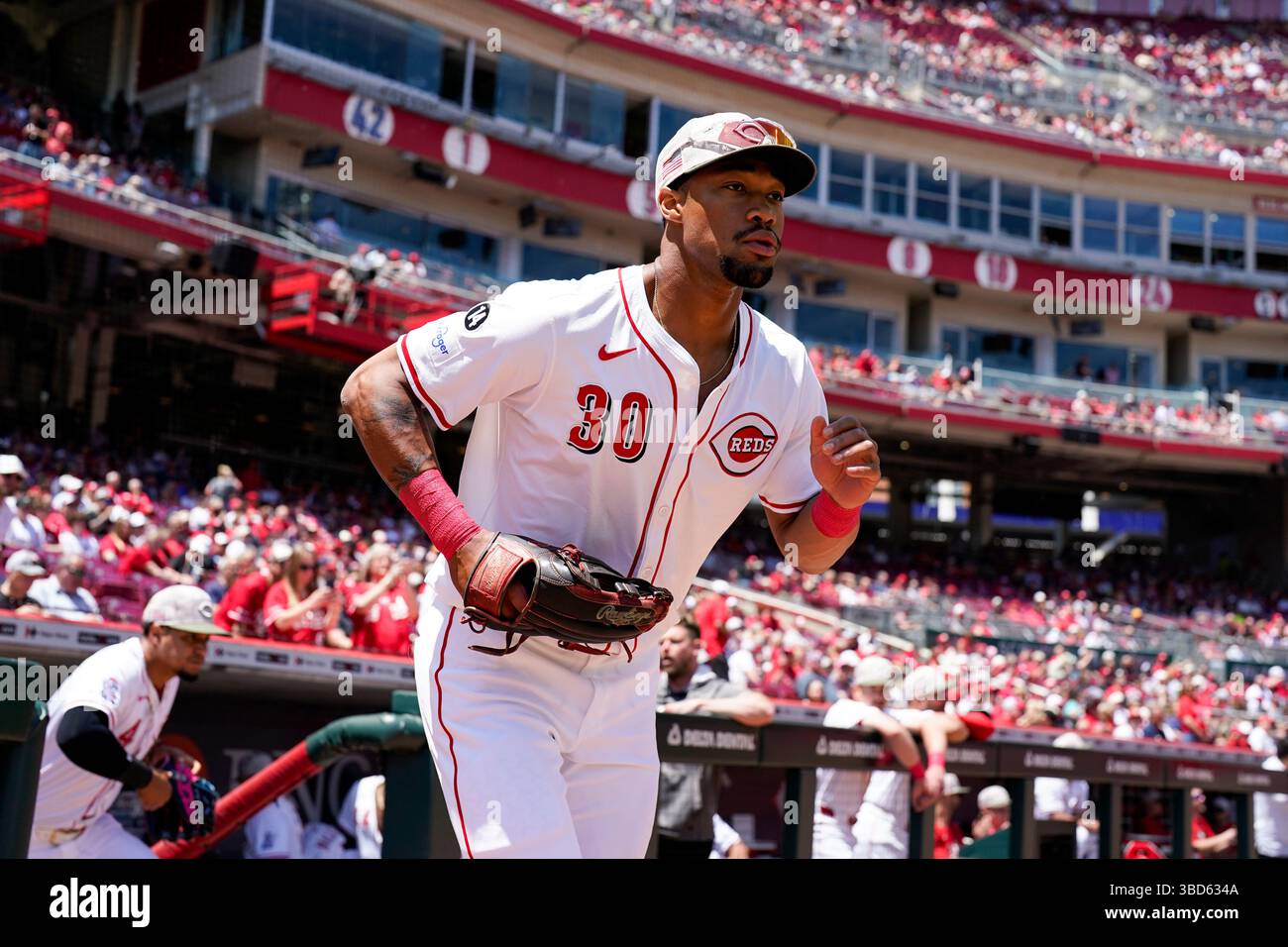 Cincinnati Reds' Will Benson (30) leaves the dugout during the first ...