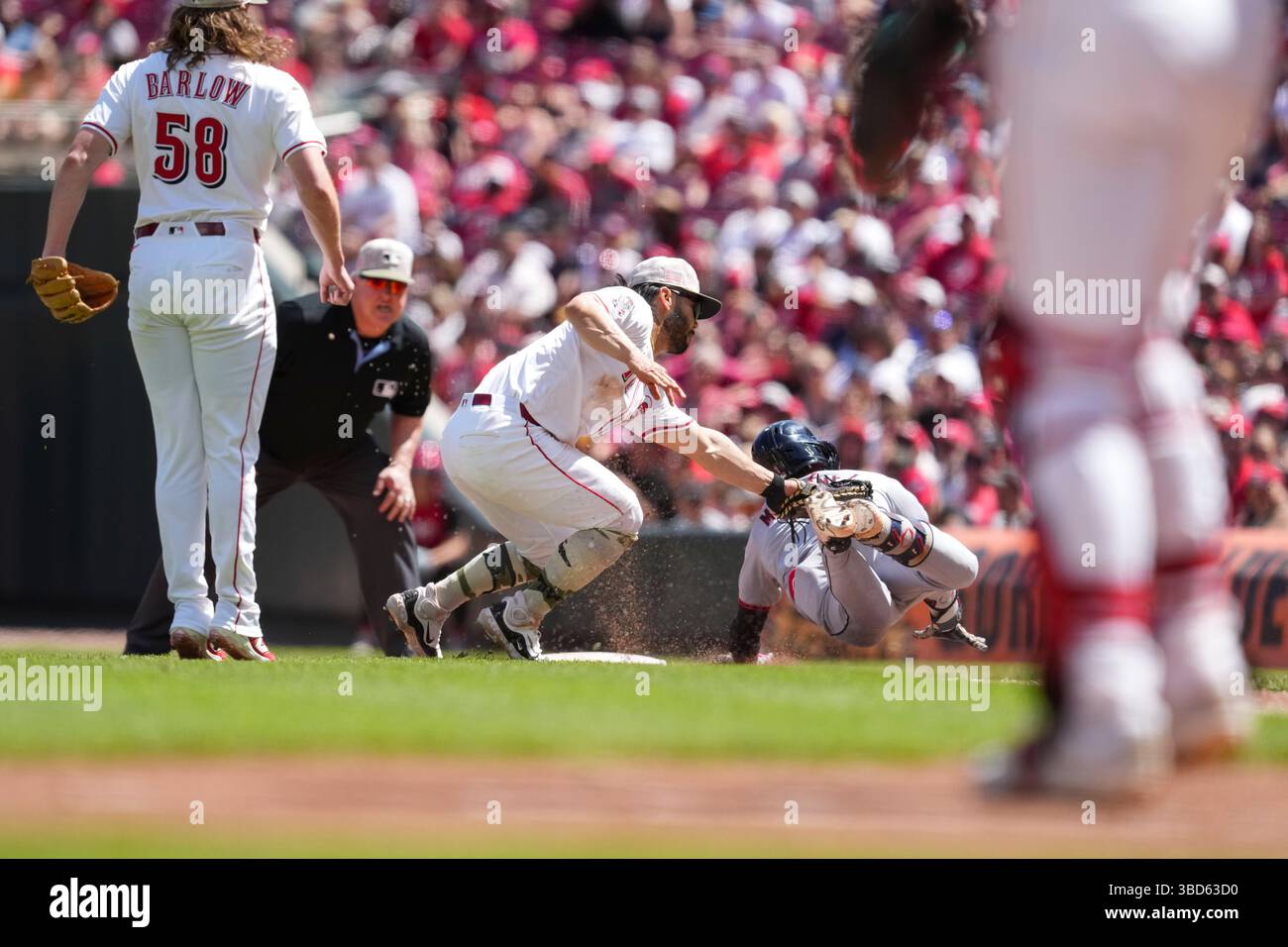 Cincinnati Reds first baseman Connor Joe, left, tags Cleveland ...