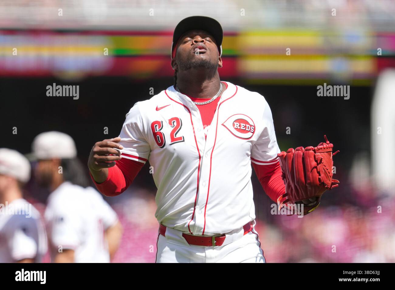 Cincinnati Reds pitcher Luis Mey (62) reacts to a pitching change by ...