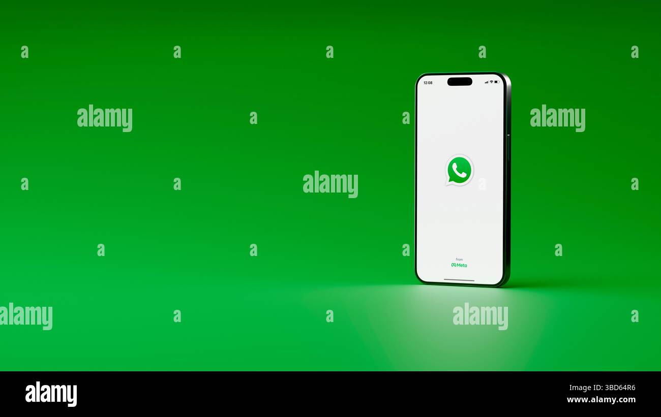 WhatsApp in mobile phone. Isolated iPhone on green background showing ...