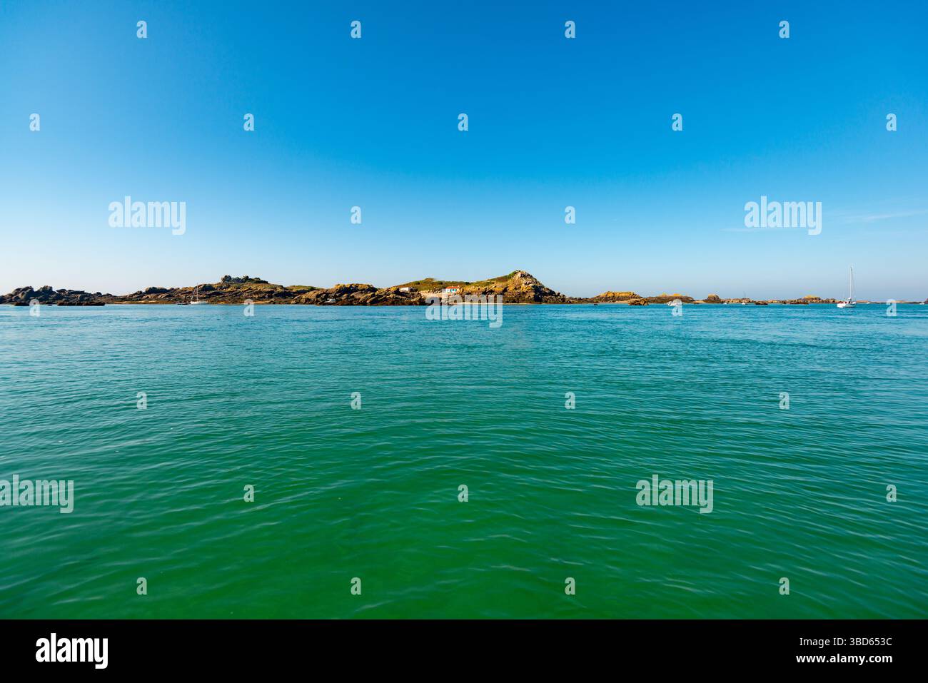 Little house isolated in an island among Chausey Islands during high ...