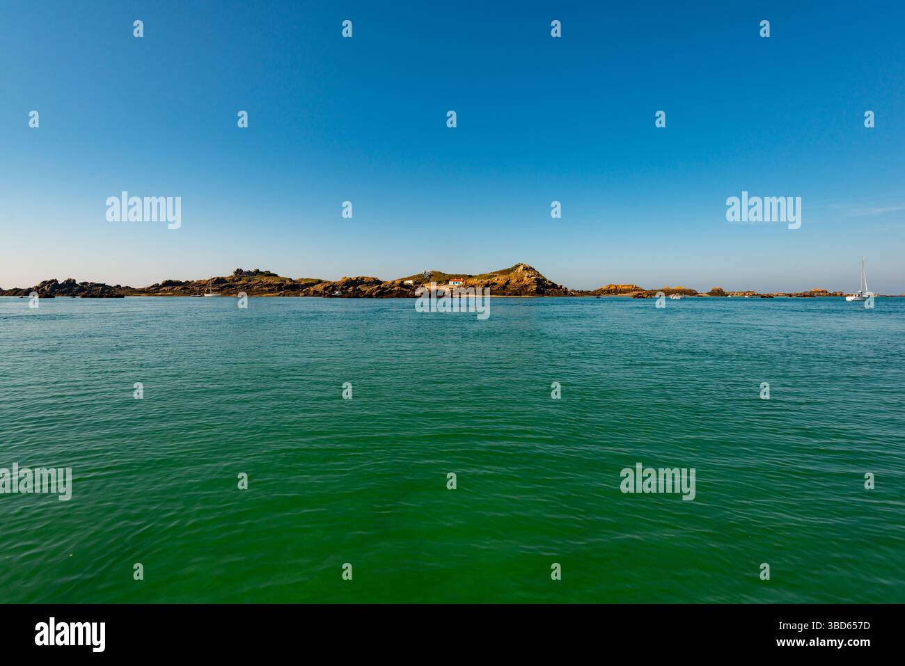 Little house isolated in an island among Chausey Islands during high ...