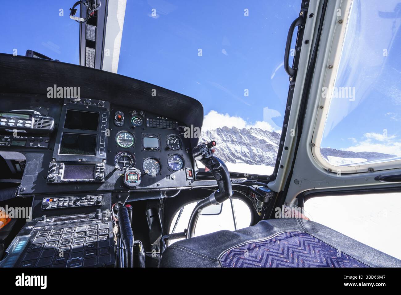 Cockpit inside of helicopter, instruments, control sticks, parks on ...