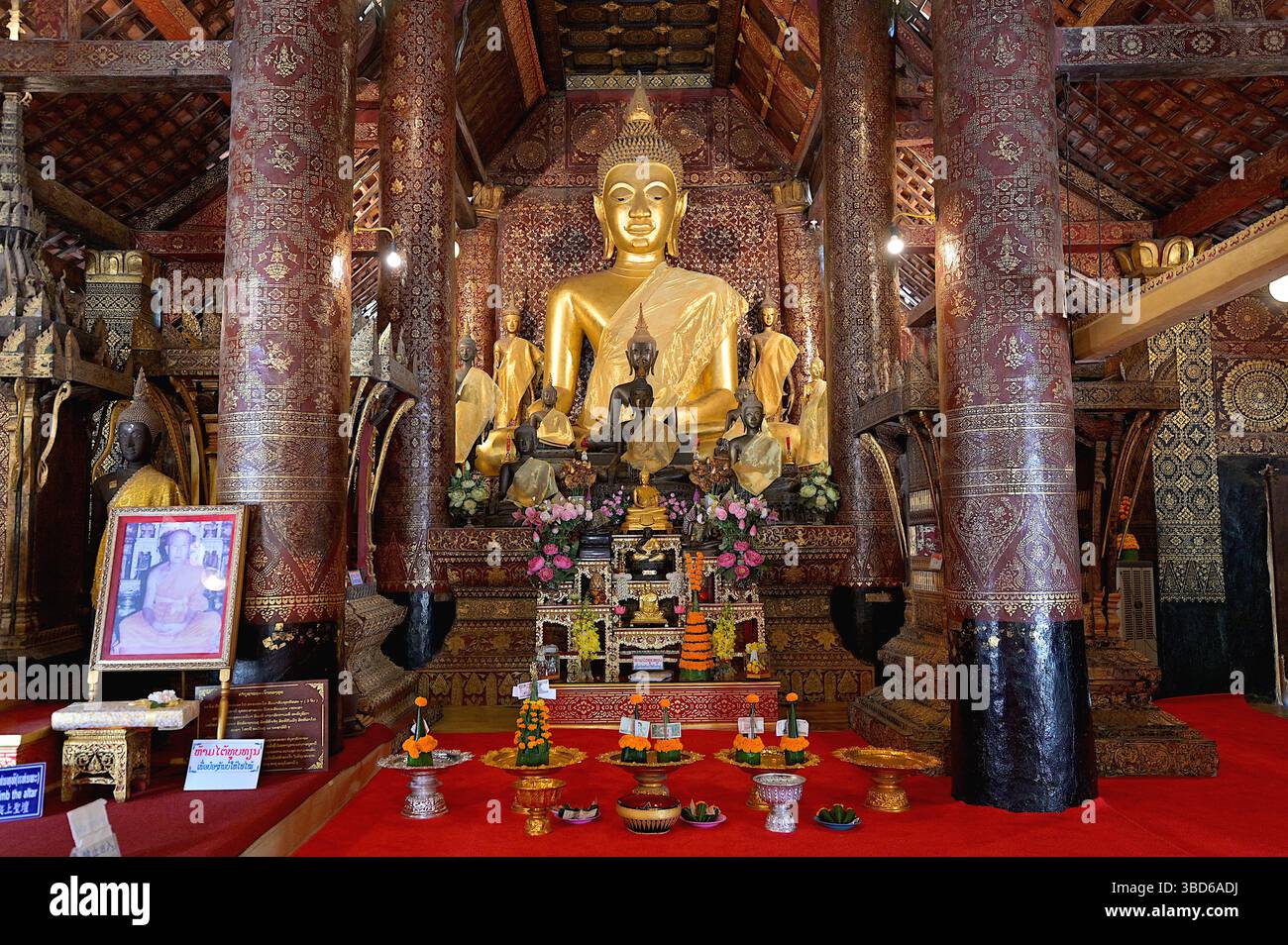 Shrine hall at Wat Xieng Thong, with Buddha image in earth-touching ...