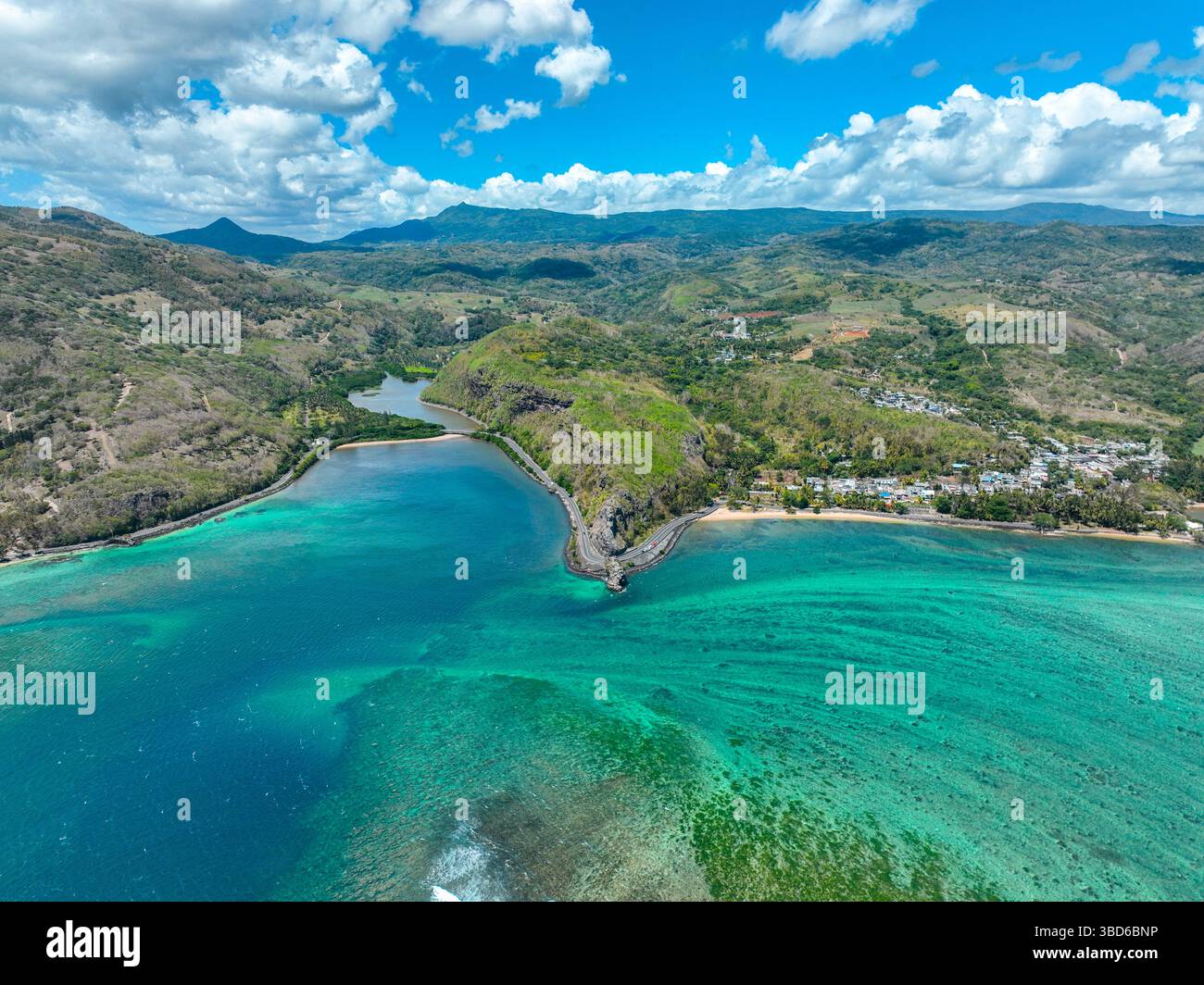 Aerial view of the emerald Indian Ocean meeting cliffs and coastal ...