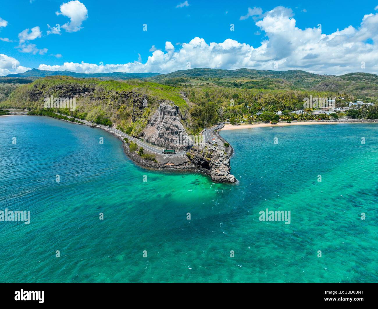 Aerial view of the emerald Indian Ocean meeting cliffs and coastal ...
