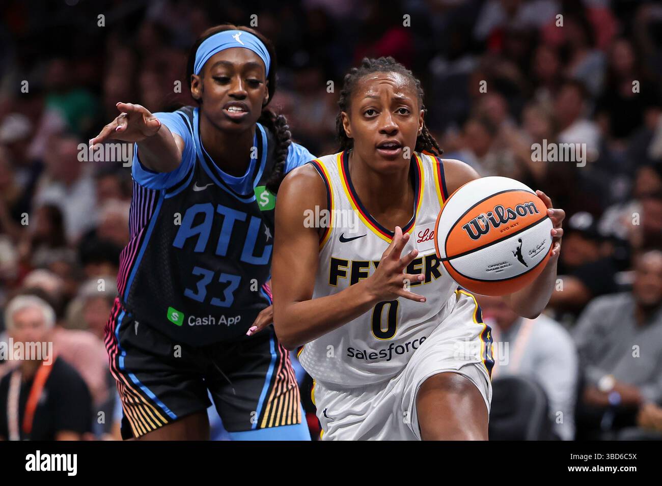 Indiana Fever guard Kelsey Mitchell (0) drives to the basket against ...
