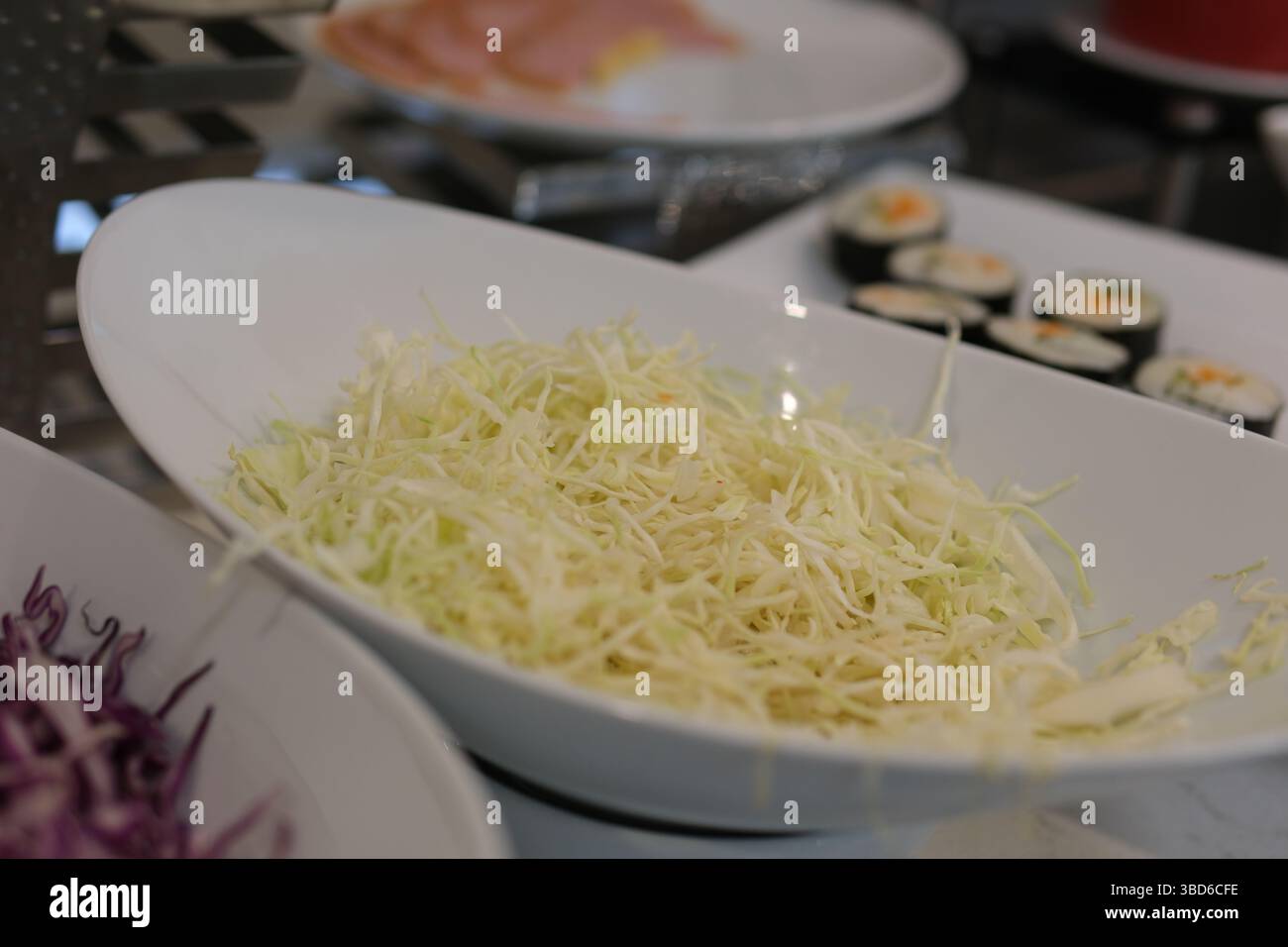 Spinning and falling shredded white cabbage slow motion Stock Photo - Alamy