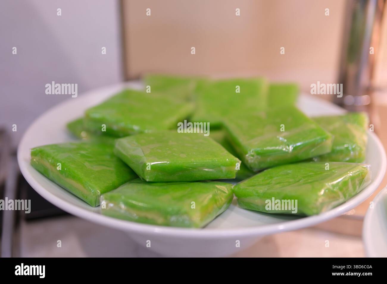 Dishes made from green rice. Green rice cake Stock Photo - Alamy