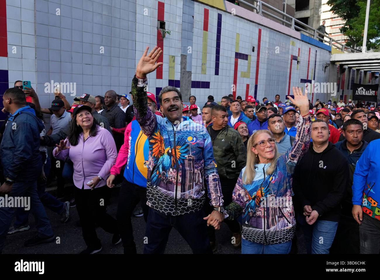 Venezuelan President Nicolas Maduro, center, and first lady Cilia ...