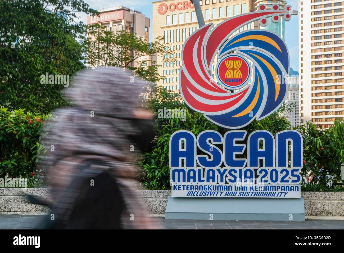 Kuala Lumpur, Malaysia. 22nd May, 2025. A woman seen passing by a ...