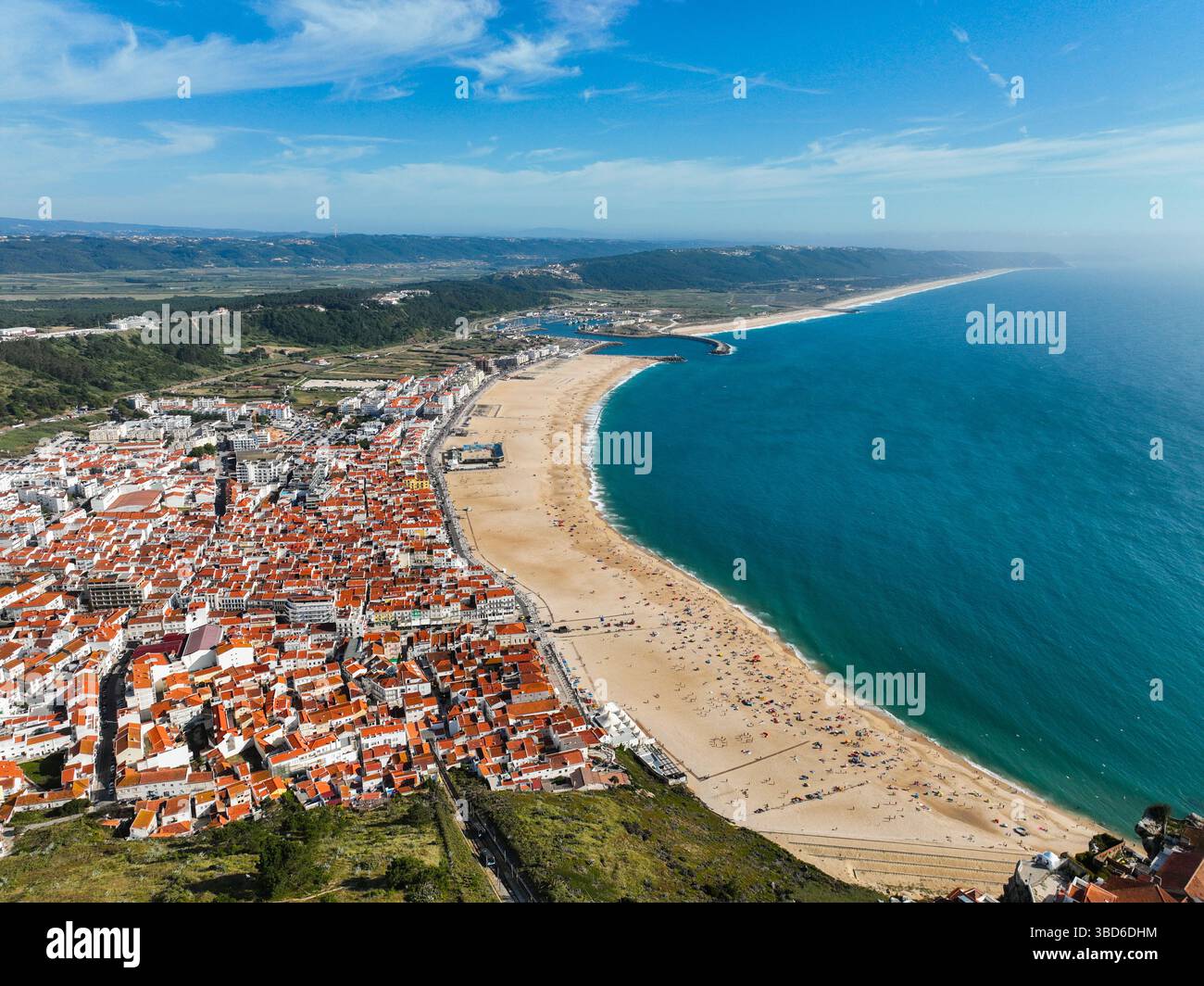 Coastal aerial of Nazare with Praia da Nazare beach, ocean, and town ...