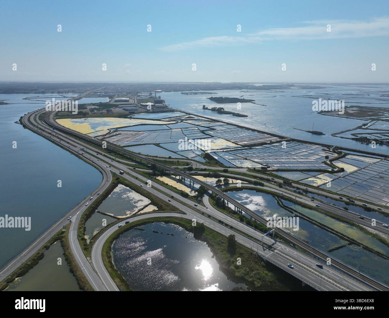 Elevated highway winds between salt flats and estuary waters near ...