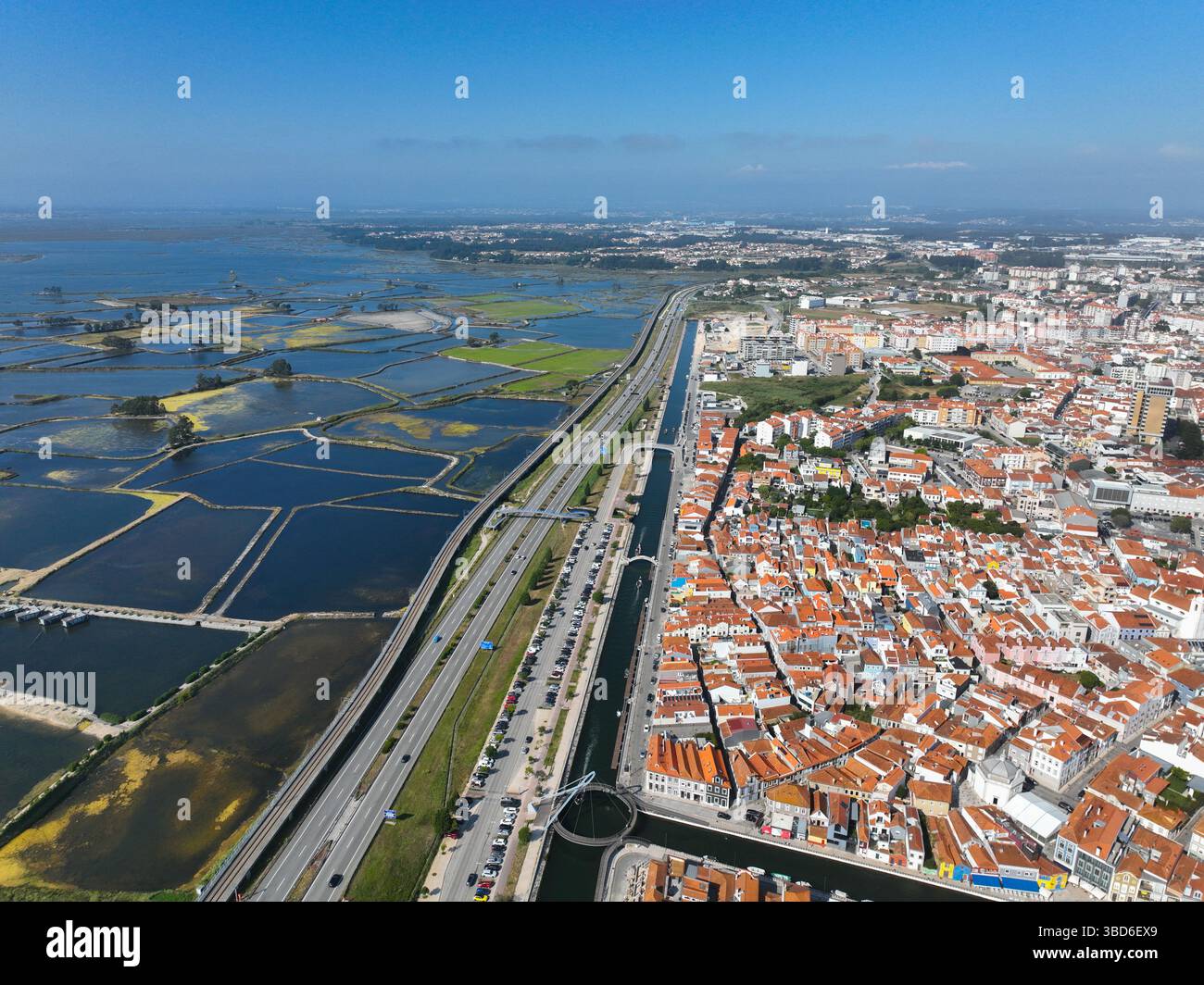 Aerial view of Aveiro, Portugal showing vibrant city blocks, salt flats ...