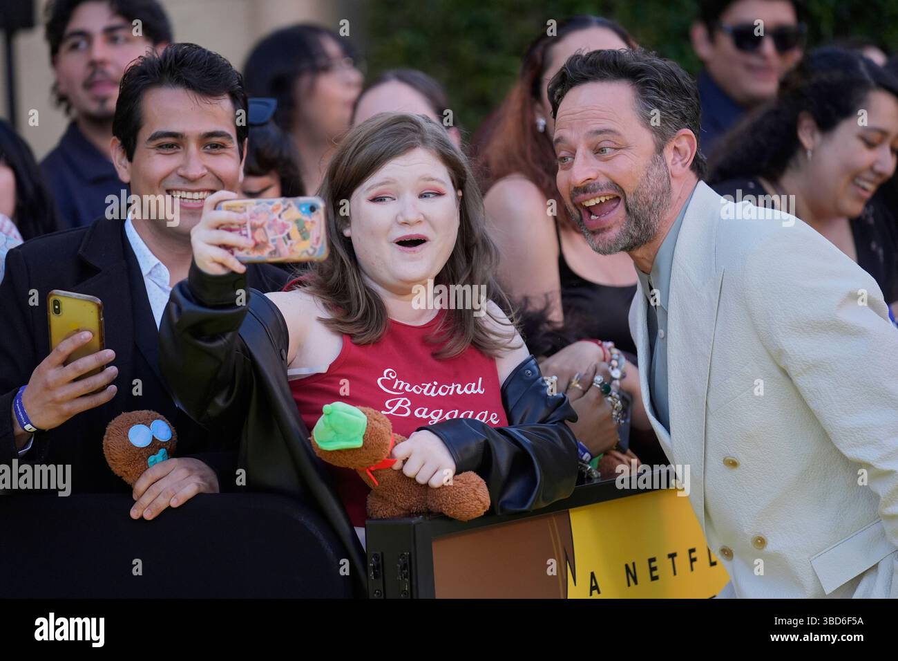 Nick Kroll, right, a cast member in "Big Mouth," poses with fans at the ...