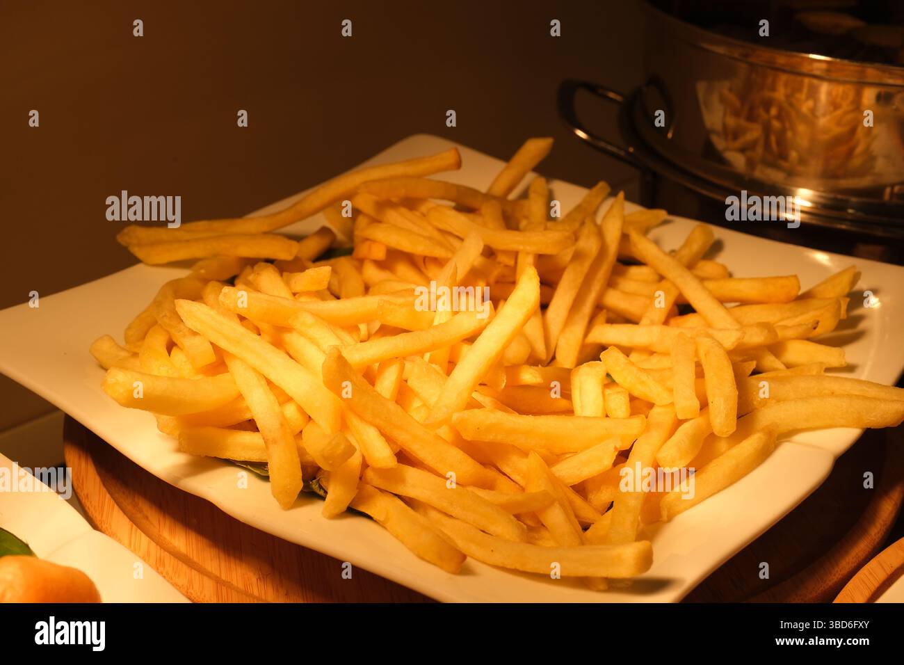 French Fries with Pommes Frites on a turntable isolated on white ...