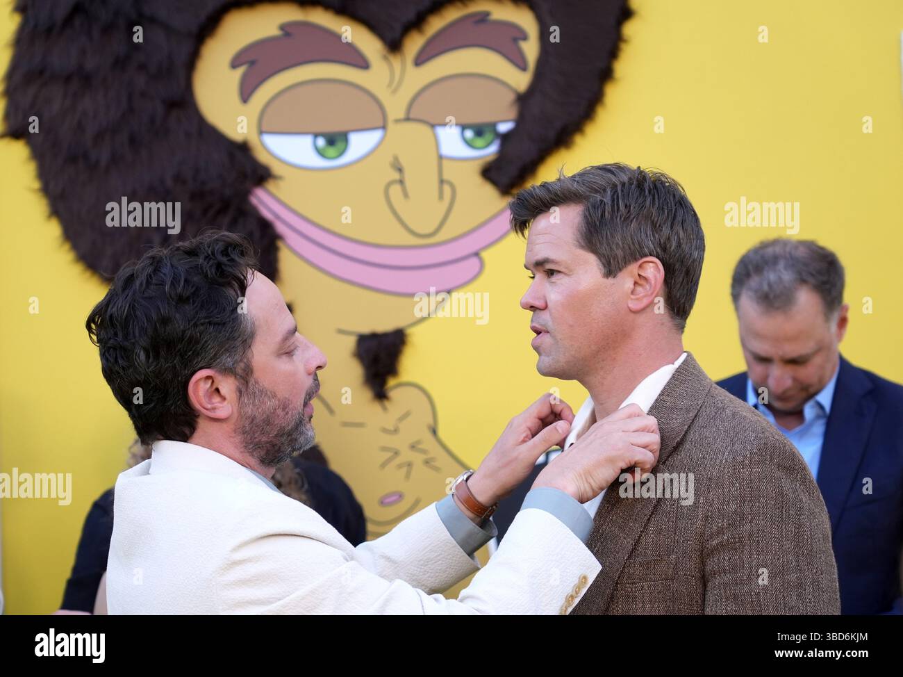 Nick Kroll, left, a cast member in "Big Mouth," primps the collar of ...